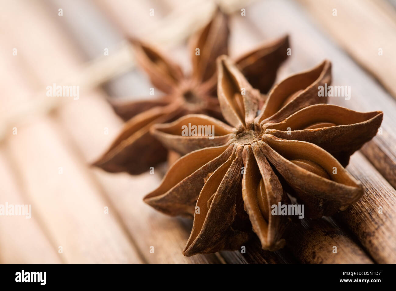 Star anis on brown background, shallow focus Stock Photo - Alamy