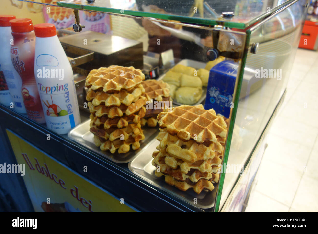Food during travels in Europe. Waffles in display case Stock Photo - Alamy