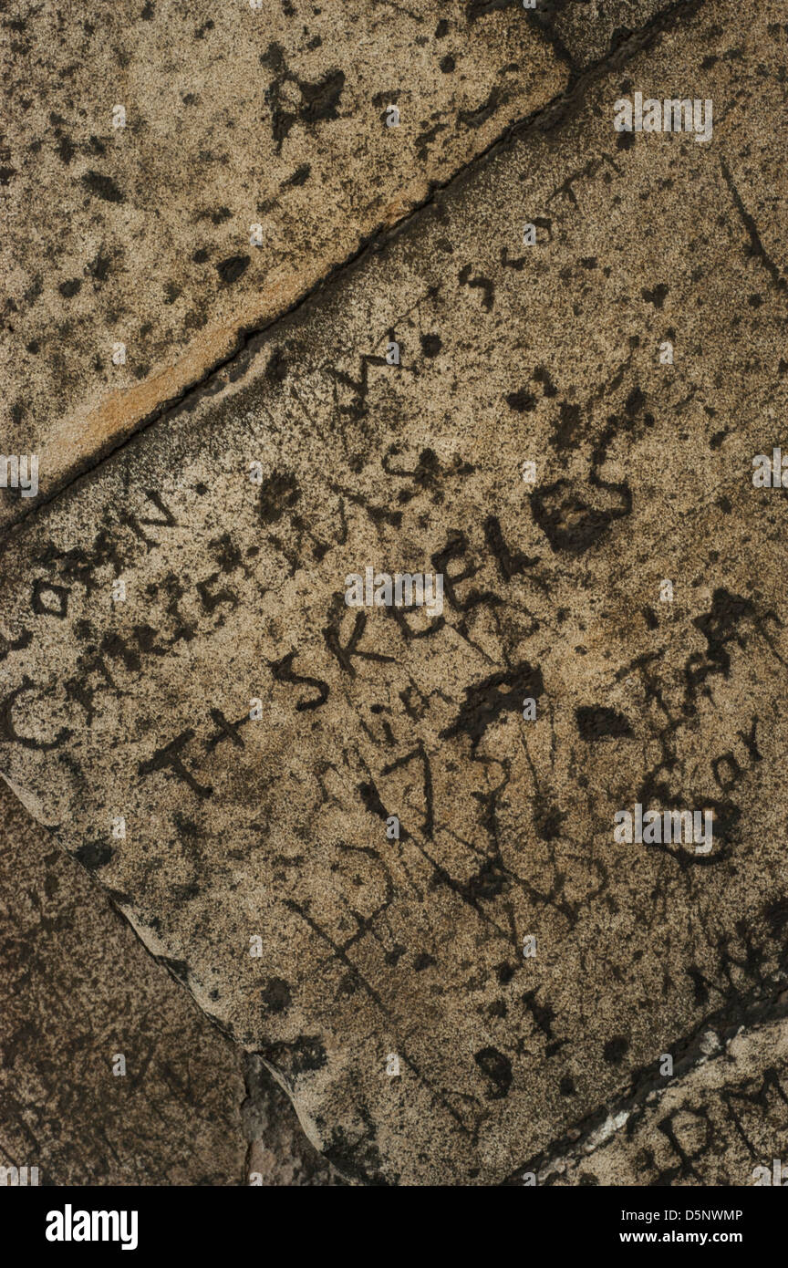 Graffiti carved into stone wall Stock Photo - Alamy