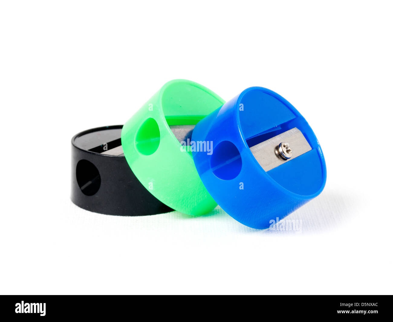 Three different colors sharpener Stock Photo - Alamy