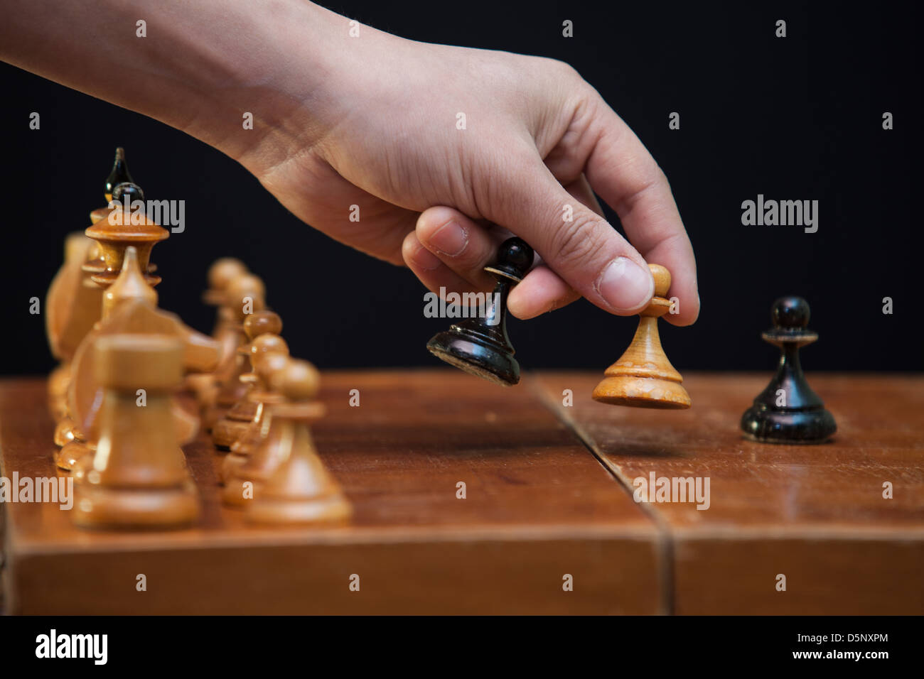 The figures placed on the board, a man's hand does pawn move Stock ...