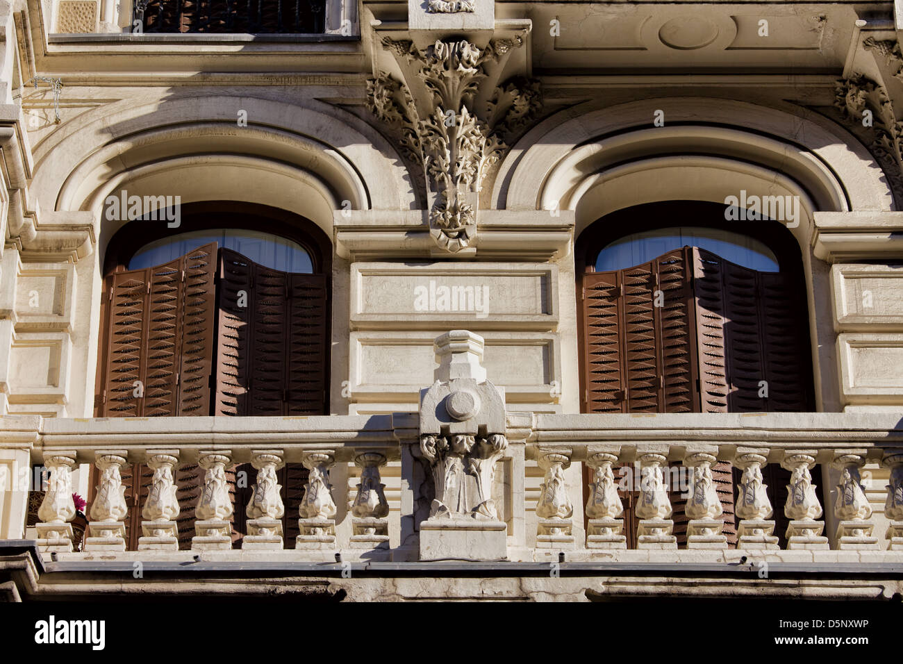 Old apartment building with balcony and arched windows in Madrid, Spain ...