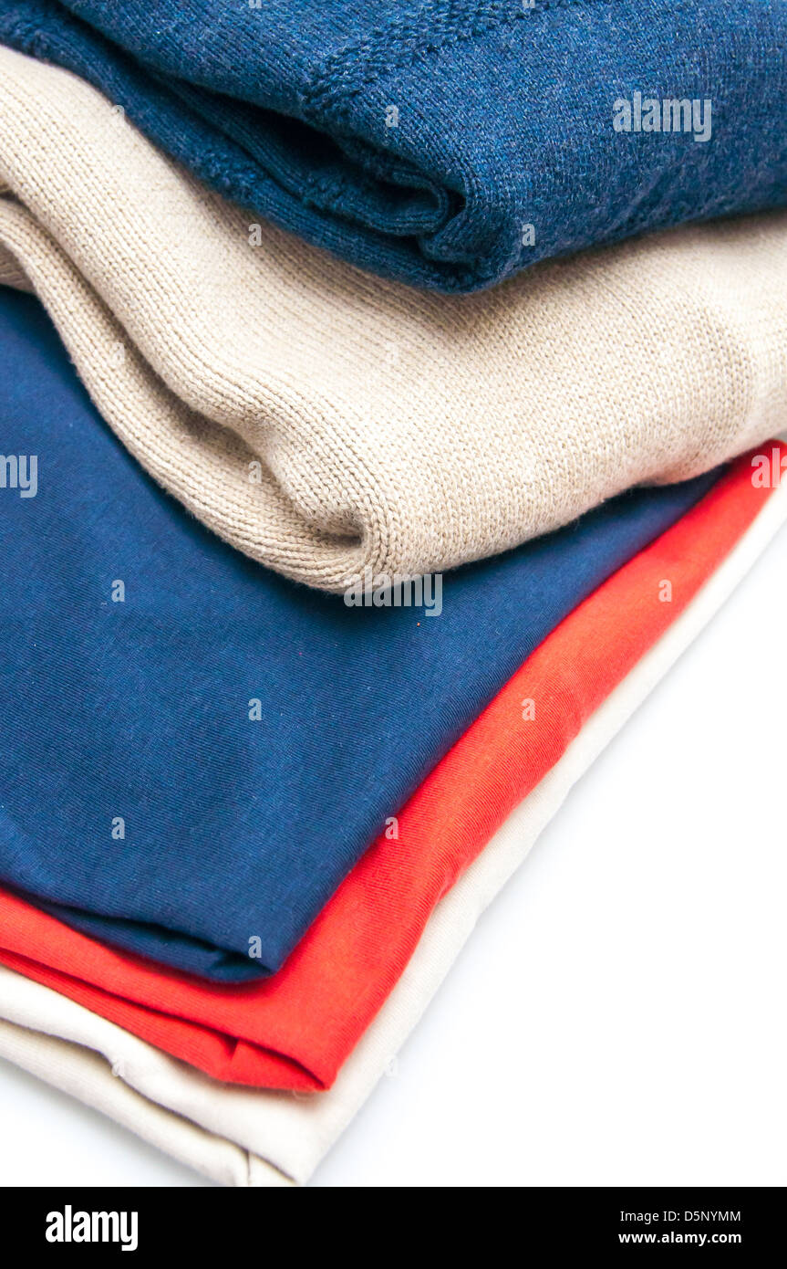 Pile of colorful clothes over white background Stock Photo - Alamy