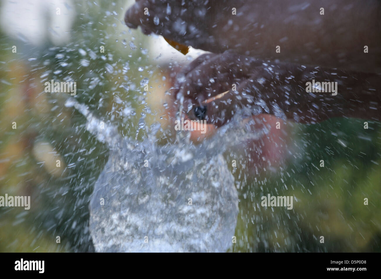 water balloon explosion with a needle to capture the right moment Stock ...
