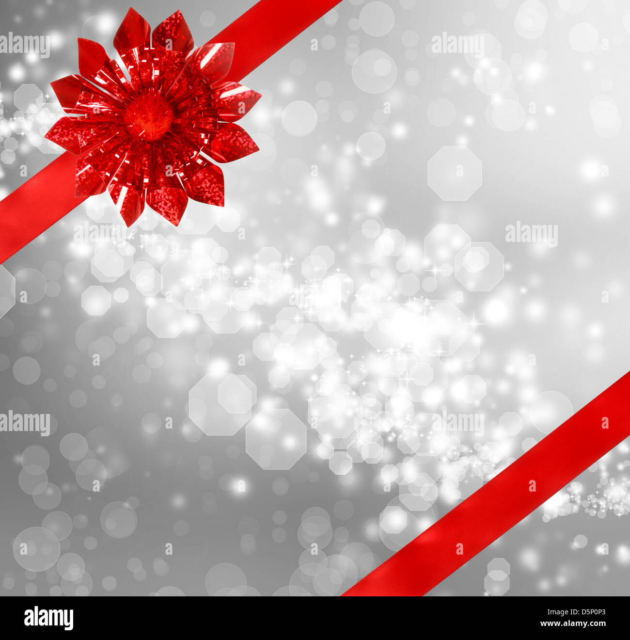 Red Bow and Ribbon with Silver Abstract Lights Background Stock Photo ...