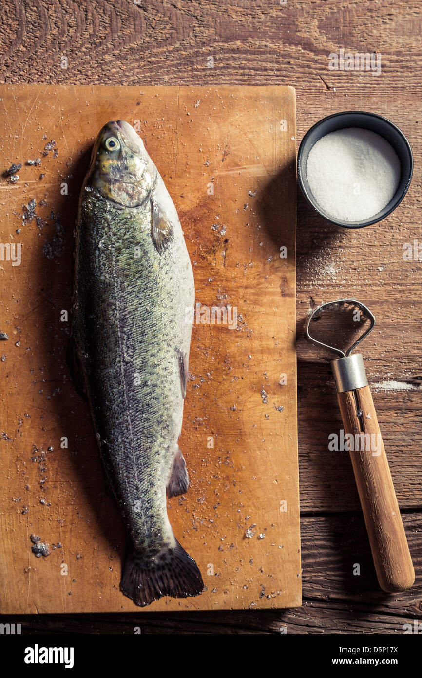 Peeling the shells of fresh fish Stock Photo - Alamy