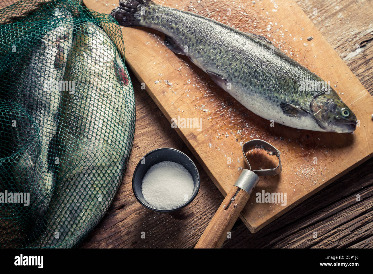 Preparing fish caught in freshwater Stock Photo - Alamy
