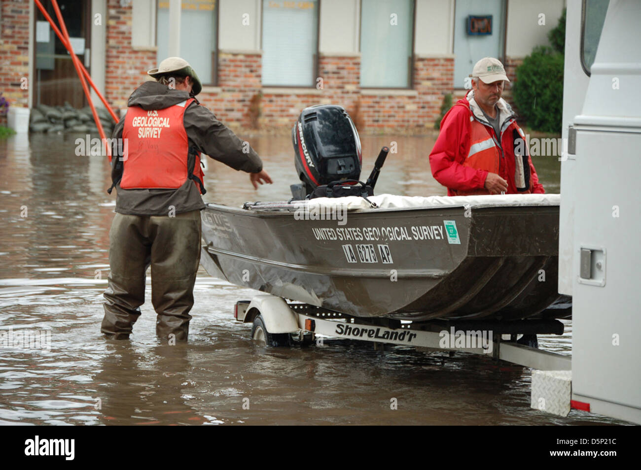 A canoe floats in flooded waters in Iowa, reflecting the challenges ...