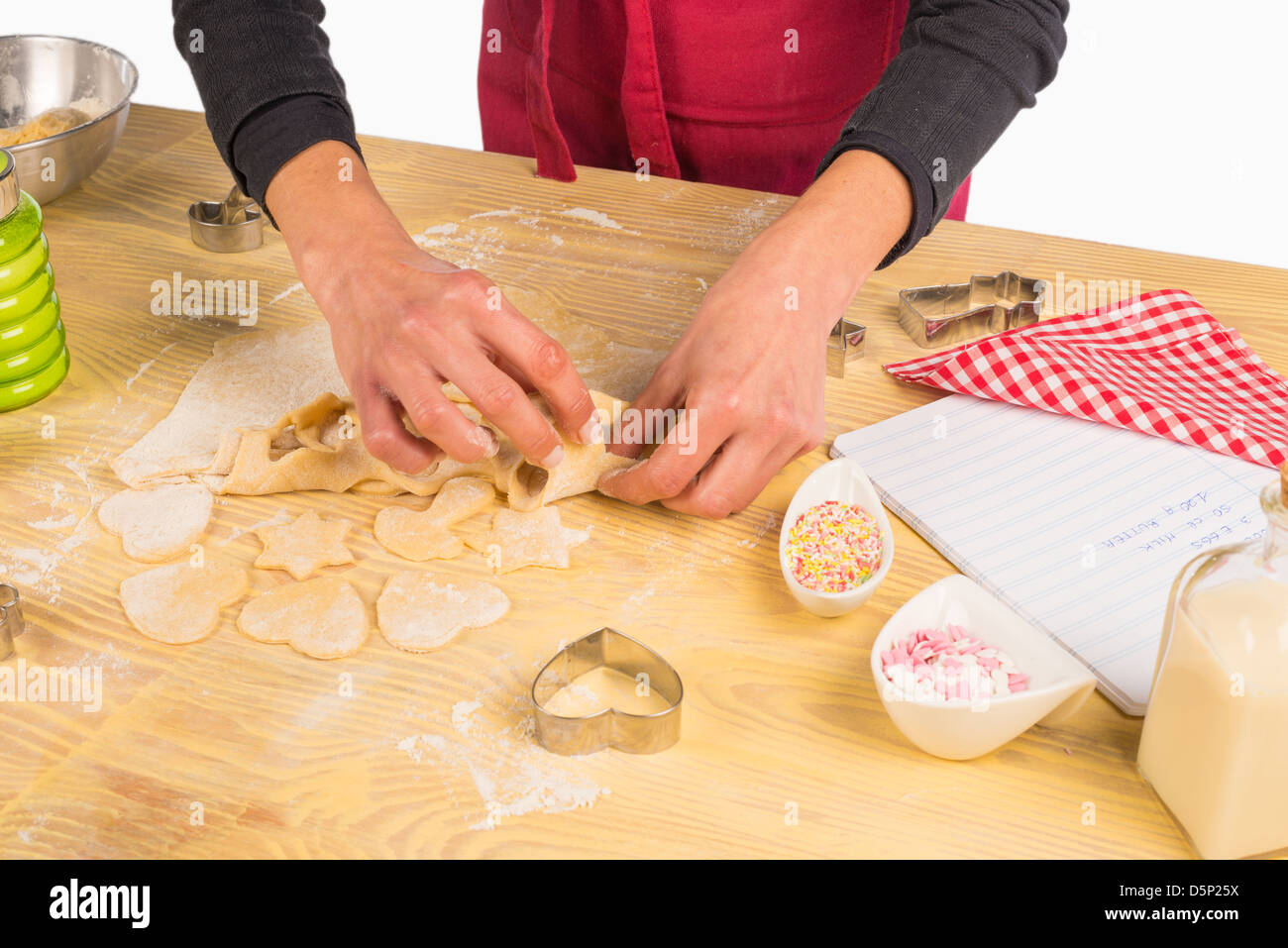 Finishing pastry cutouts to prepare some fancy cookies Stock Photo - Alamy