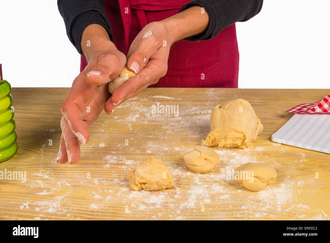 Preparing homemade biscuits, female hands rolling small buns Stock ...