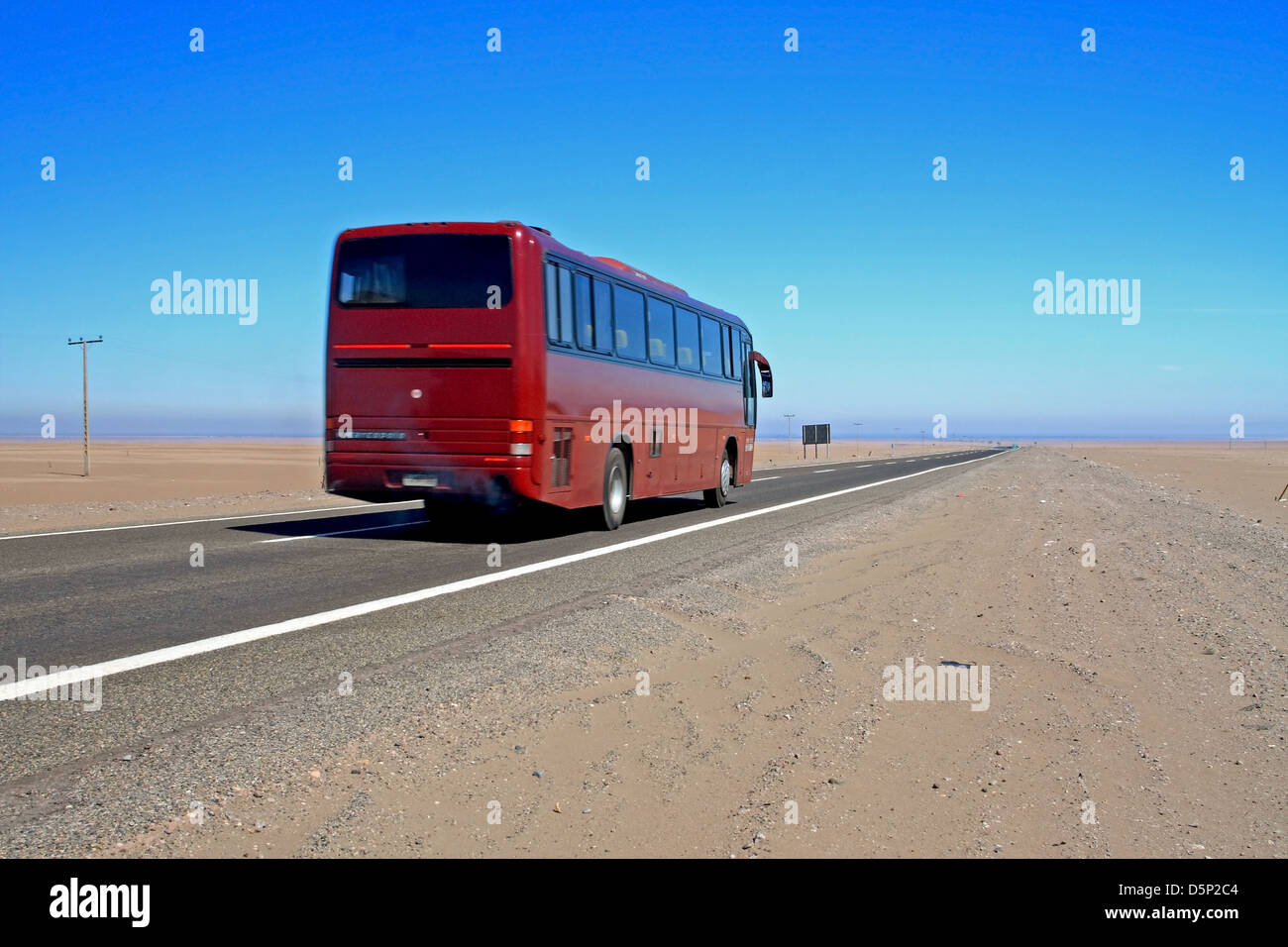Bus travelling on the Panamerican Highway, where it crosses the Atacama ...