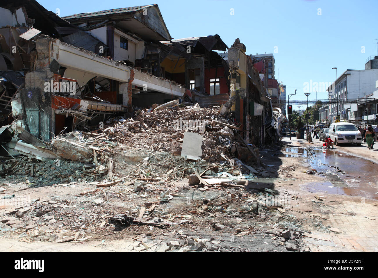 This image shows the impact of natural disasters, including a tsunami ...