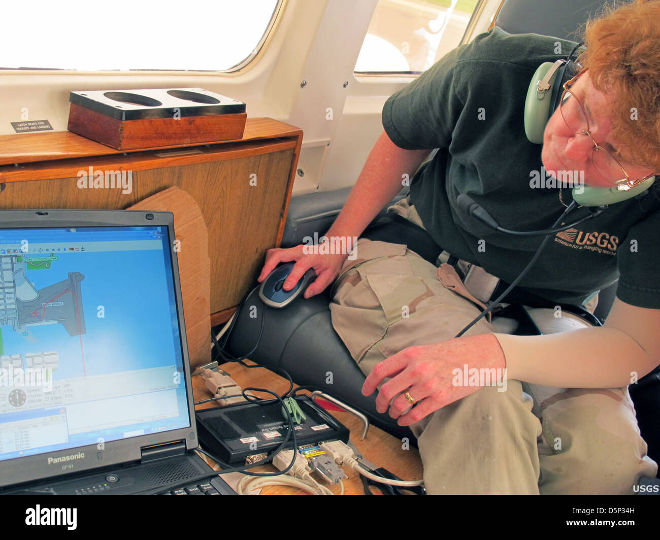 Research personnel from USGS measure and assess the environmental ...