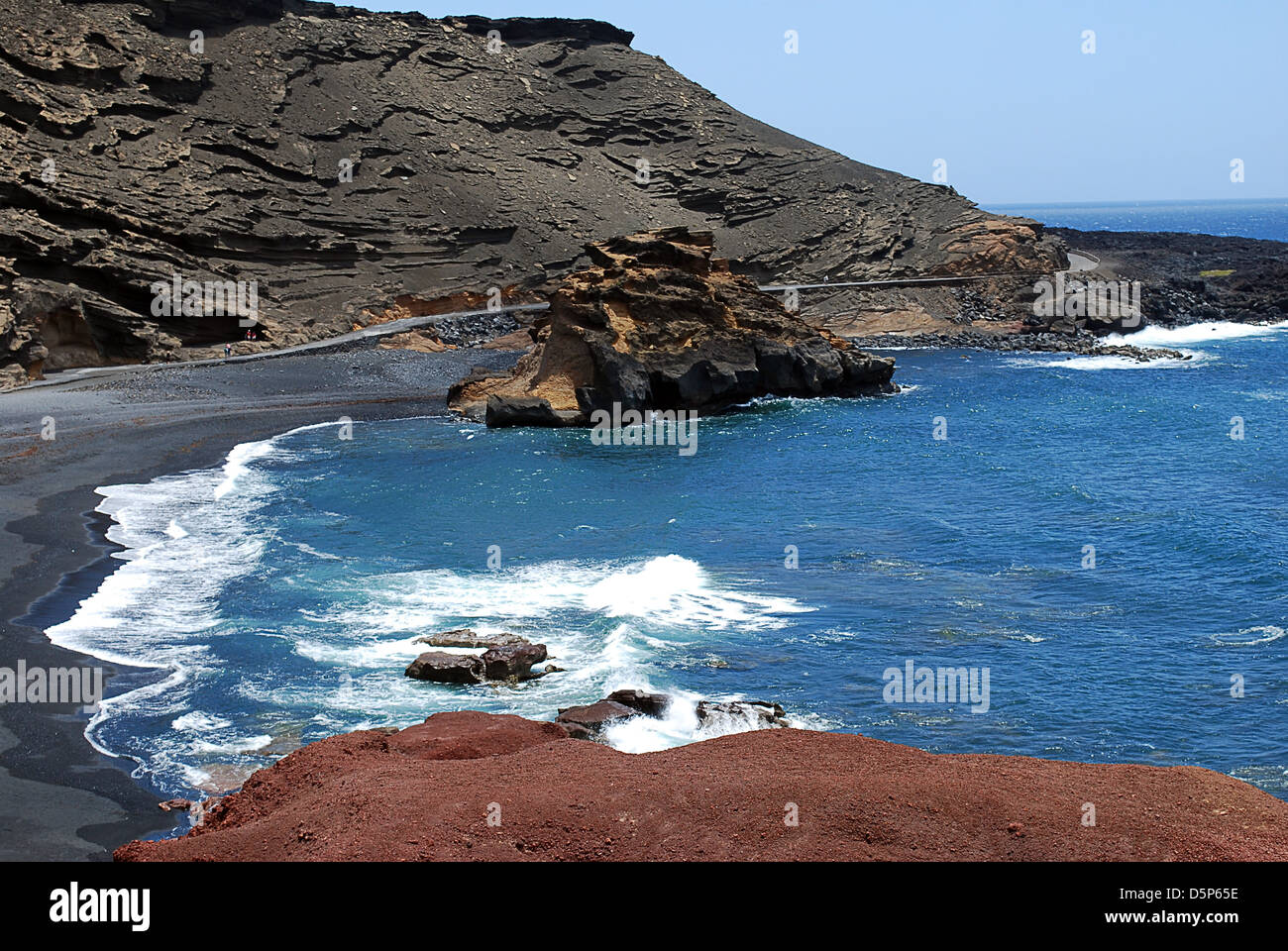 Lanzarote beach with volcanic landscape Stock Photo - Alamy