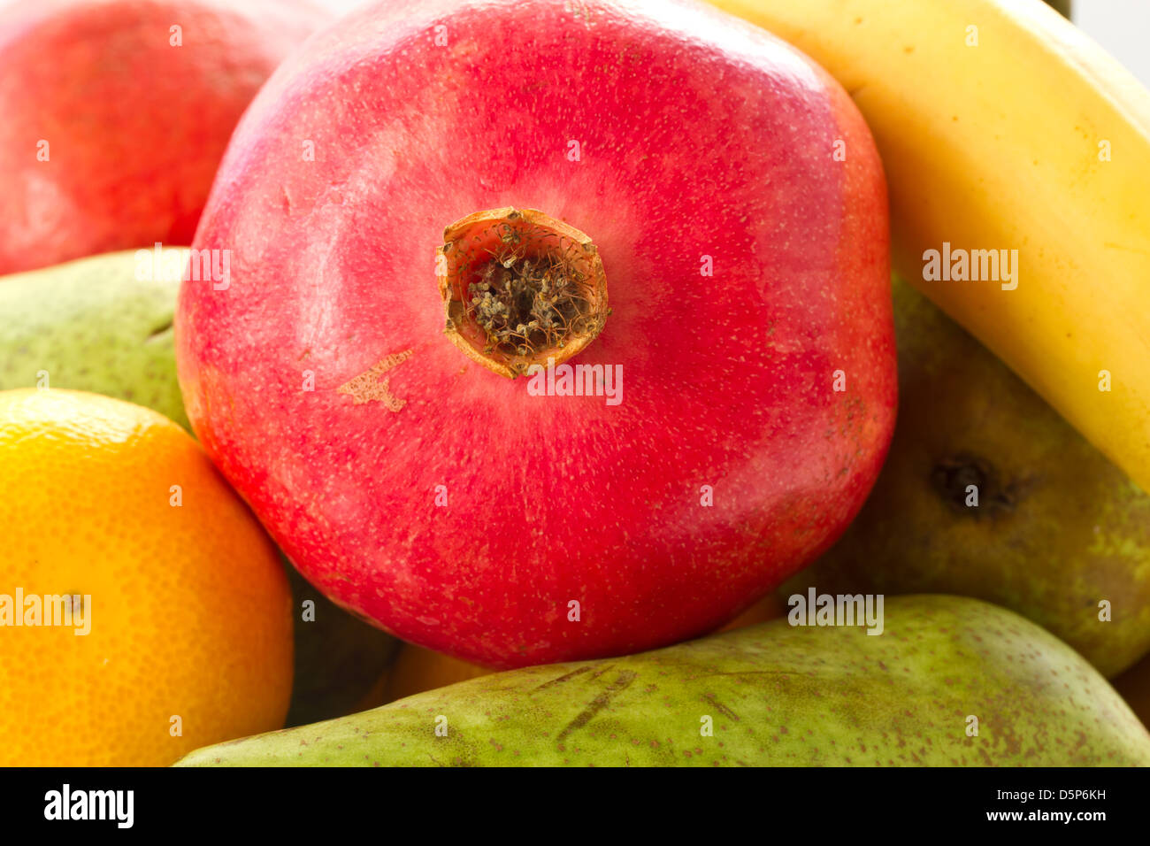 red ripe pomegranate fruit of a closeup Stock Photo - Alamy