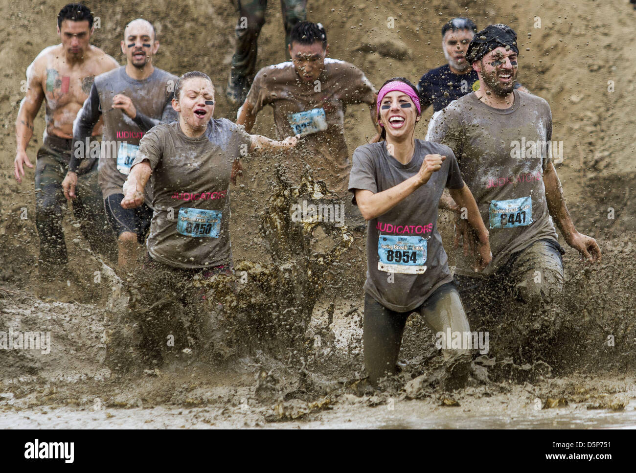 Los Angeles, California, USA. 6th April, 2013. Runners cross the mud ...