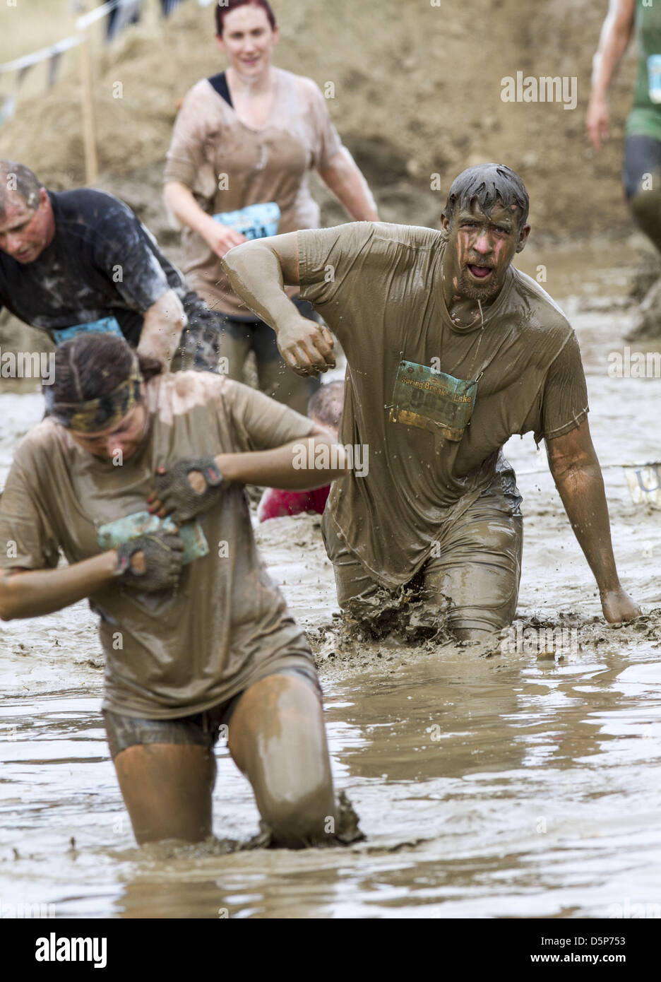 Los Angeles, California, USA. 6th April, 2013. Runners cross the mud ...