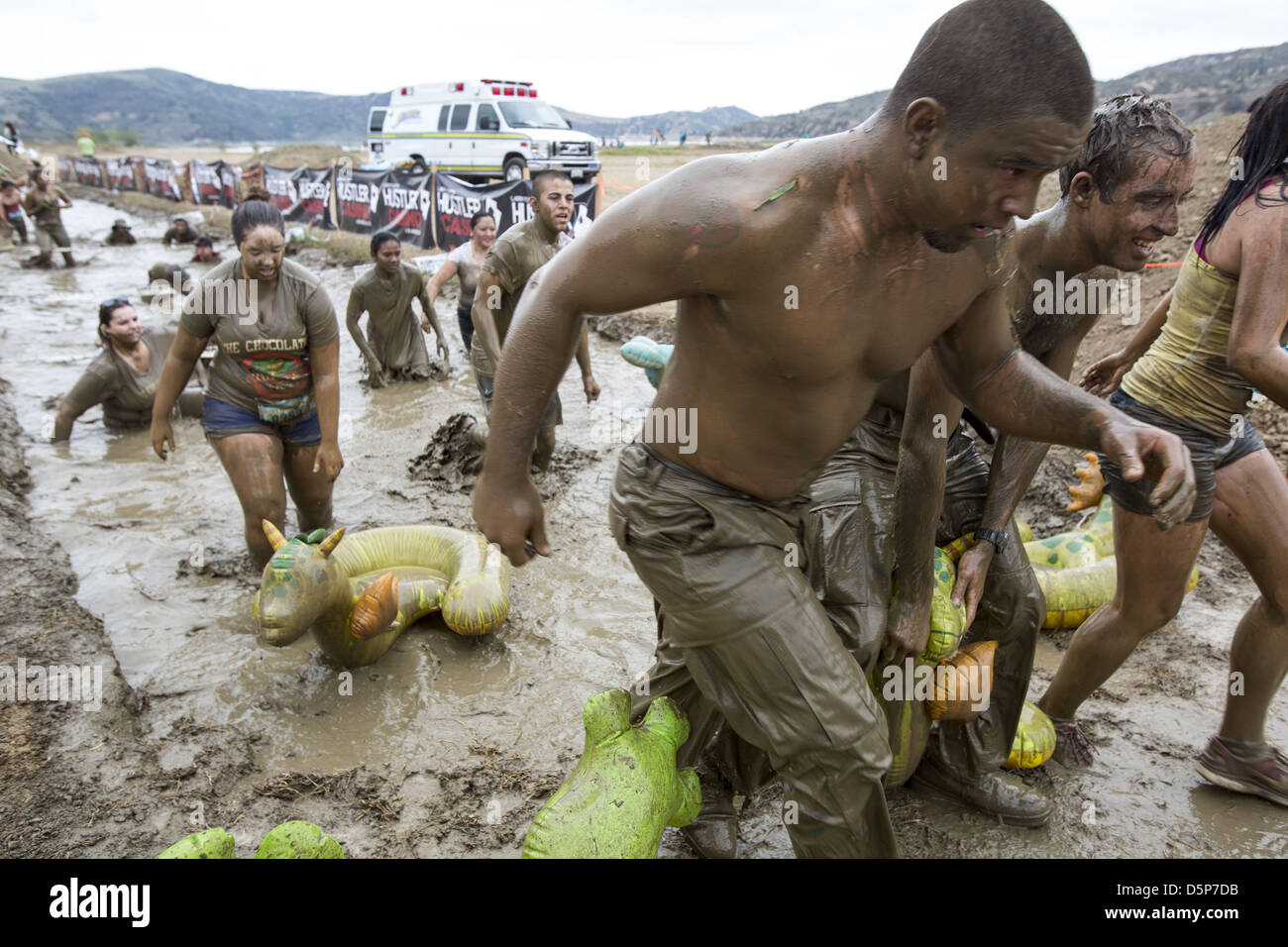 Los Angeles, California, USA. 6th April, 2013. Runners cross the mud ...