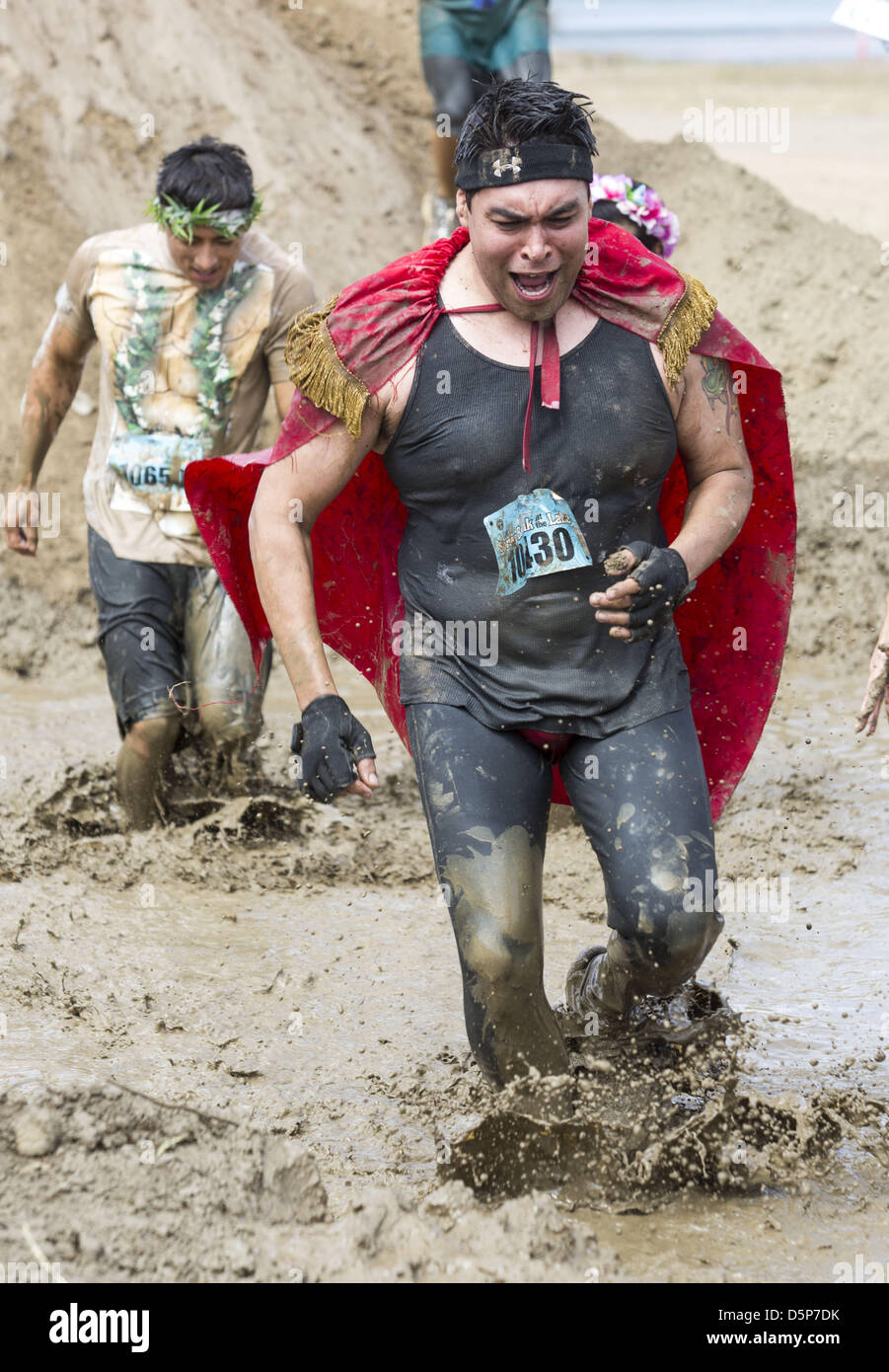 Los Angeles, California, USA. 6th April, 2013. Runners cross the mud ...