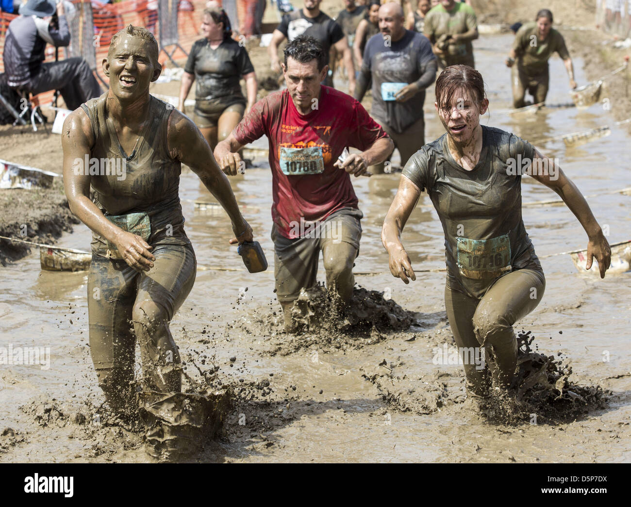 Los Angeles, California, USA. 6th April, 2013. Runners cross the mud ...