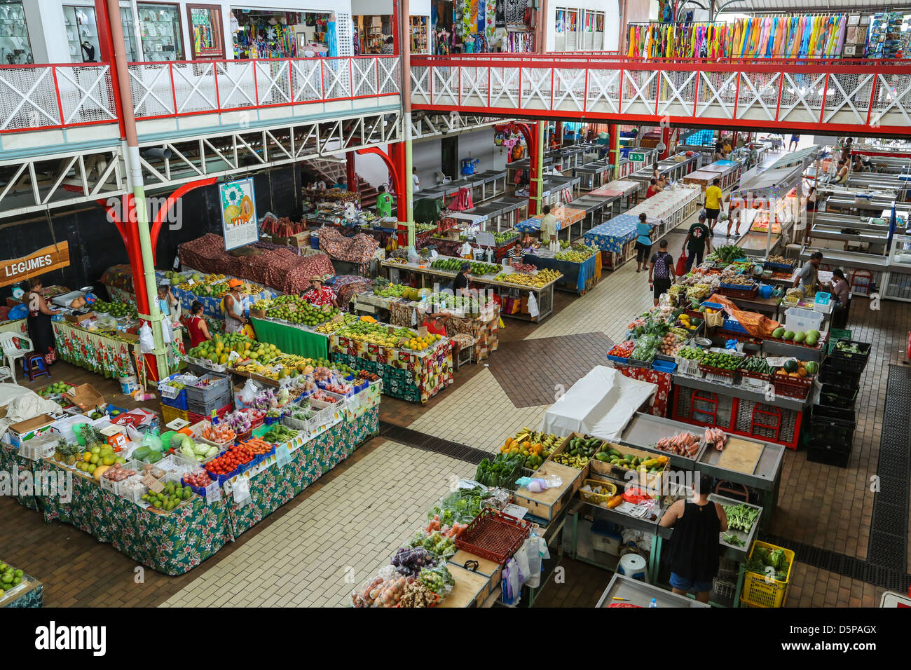 Vegetable stalls and other shops inside the public market building in ...