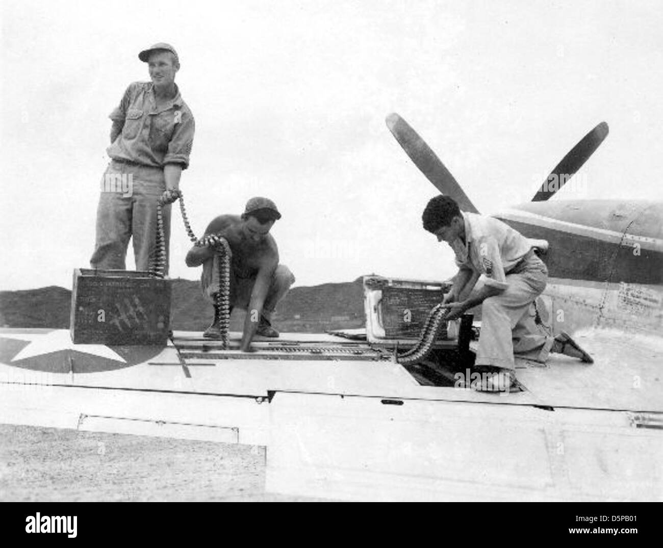 This image shows the arming of the F-6K Snooper aircraft guns. The F-6K ...