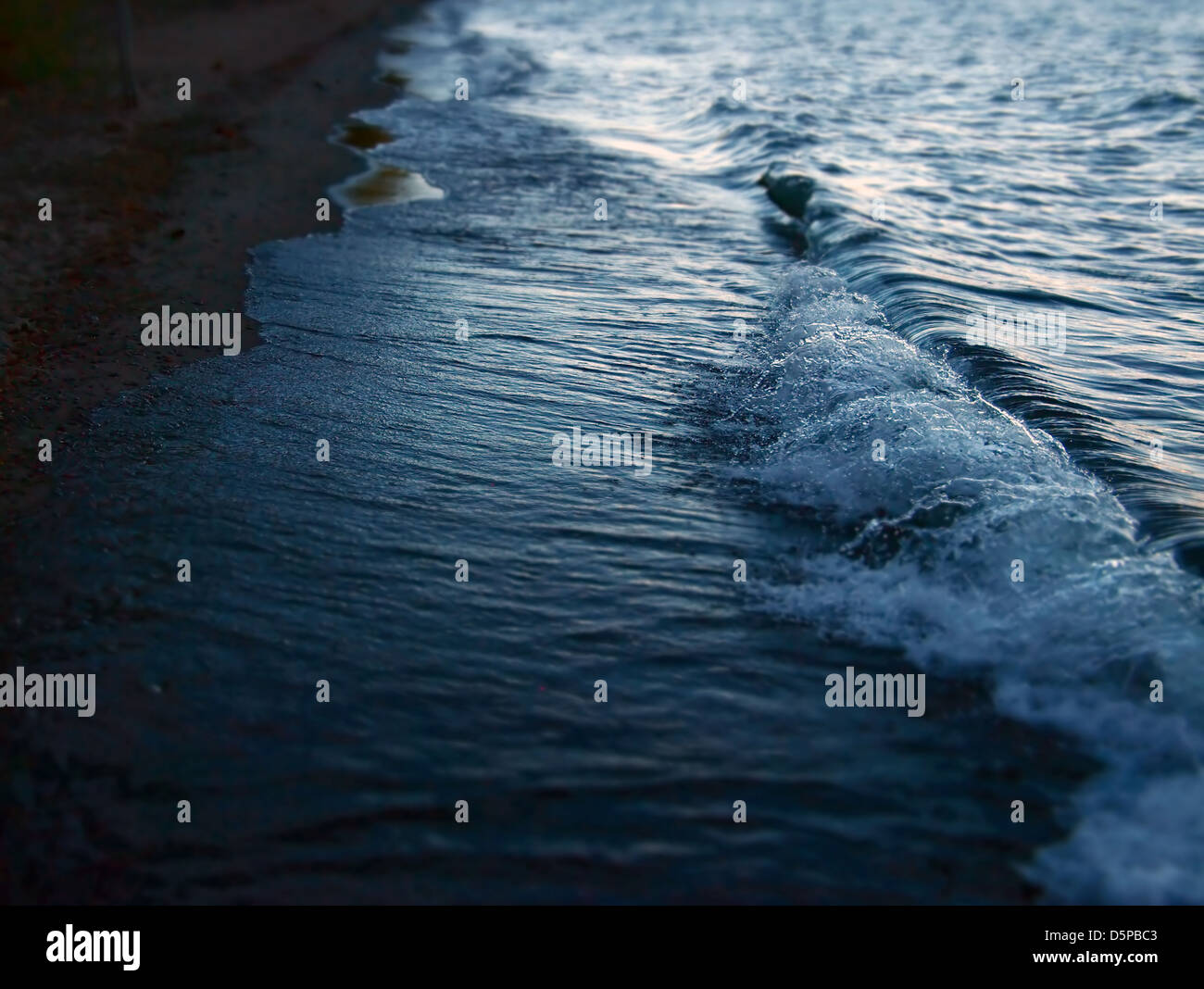 Waves on a beach Stock Photo - Alamy