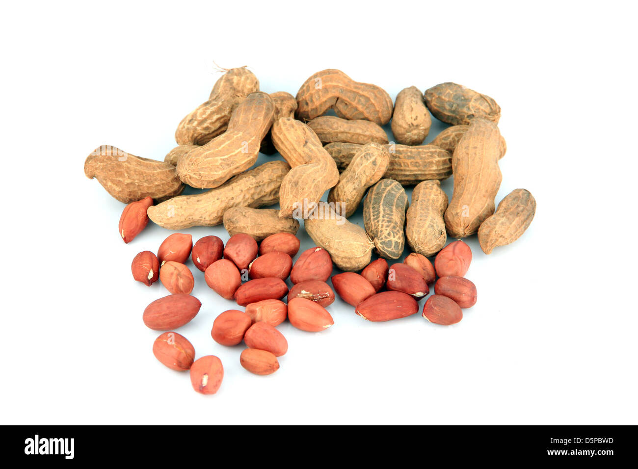 A lot of Peanuts on isolated over white background Stock Photo - Alamy