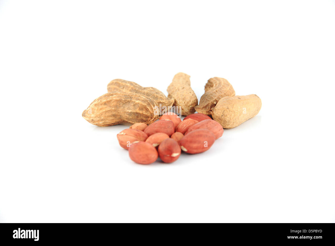 A lot of Peanuts on isolated over white background,focus on foreground ...