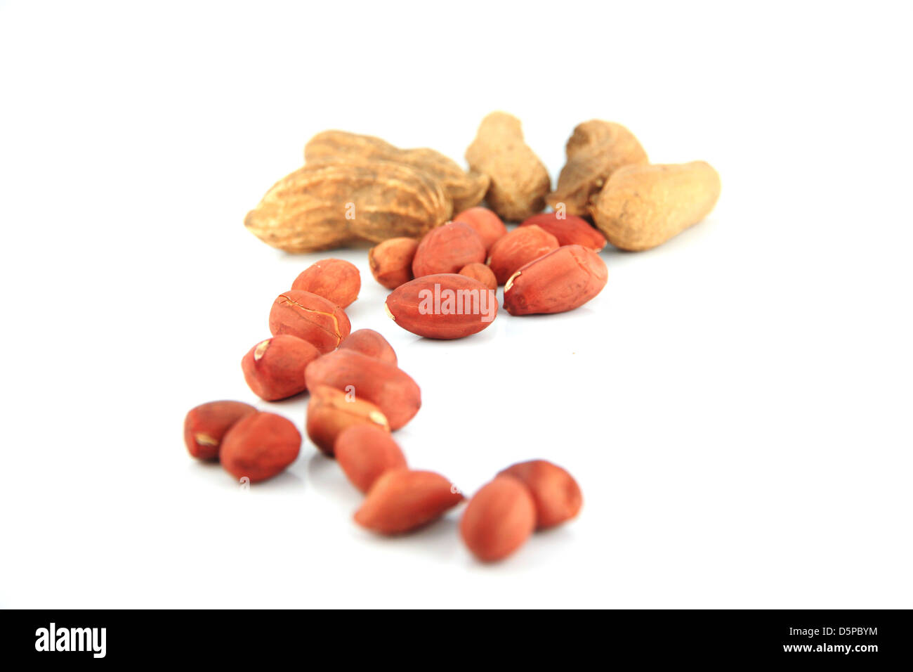 A lot of Peanuts on isolated over white background,focus on foreground ...
