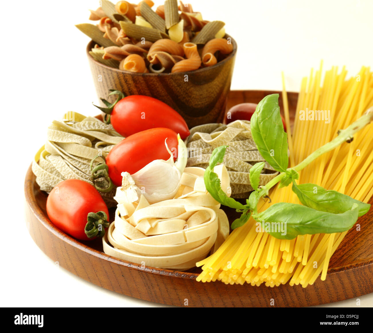 Various types of pasta (spaghetti, fettuccini, penne) and tomato Stock ...
