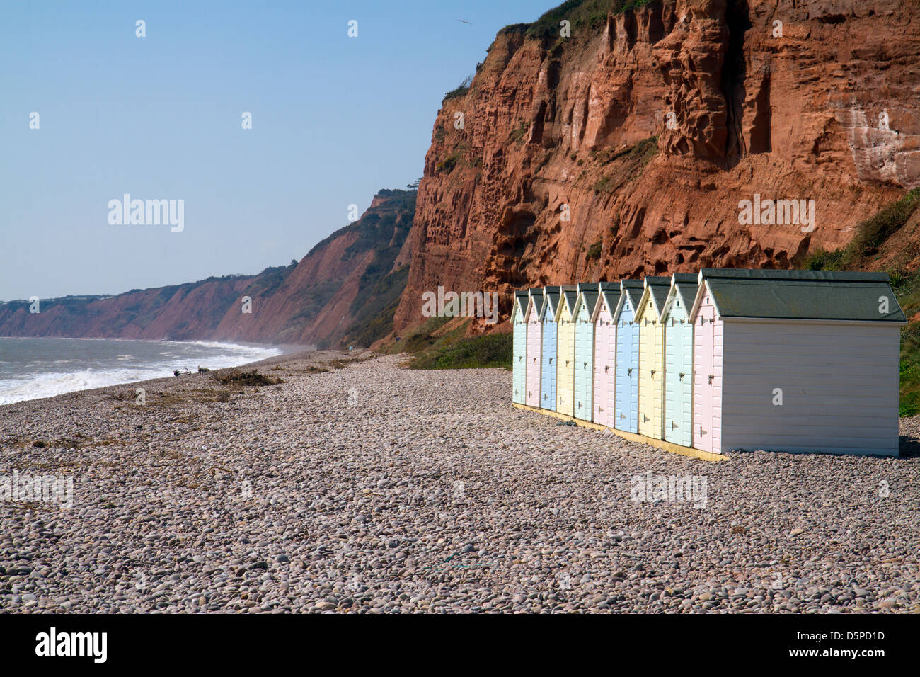 Budleigh Salterton Devon England UK beach huts and sandstone cliffs ...