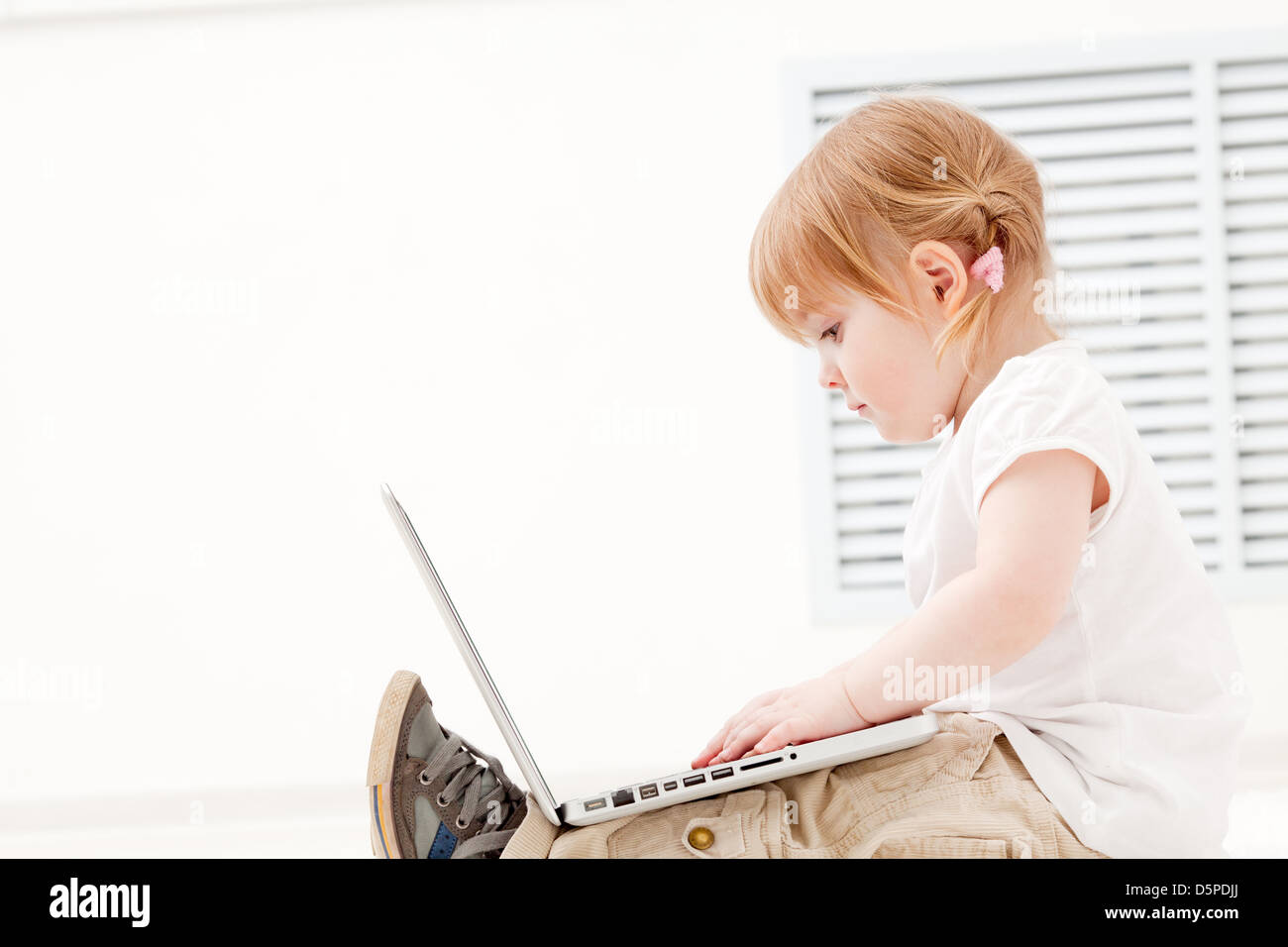 Child with laptop Stock Photo - Alamy