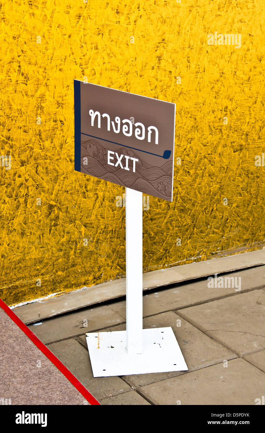 Exit signs. Mounted on white steel poles Stock Photo - Alamy