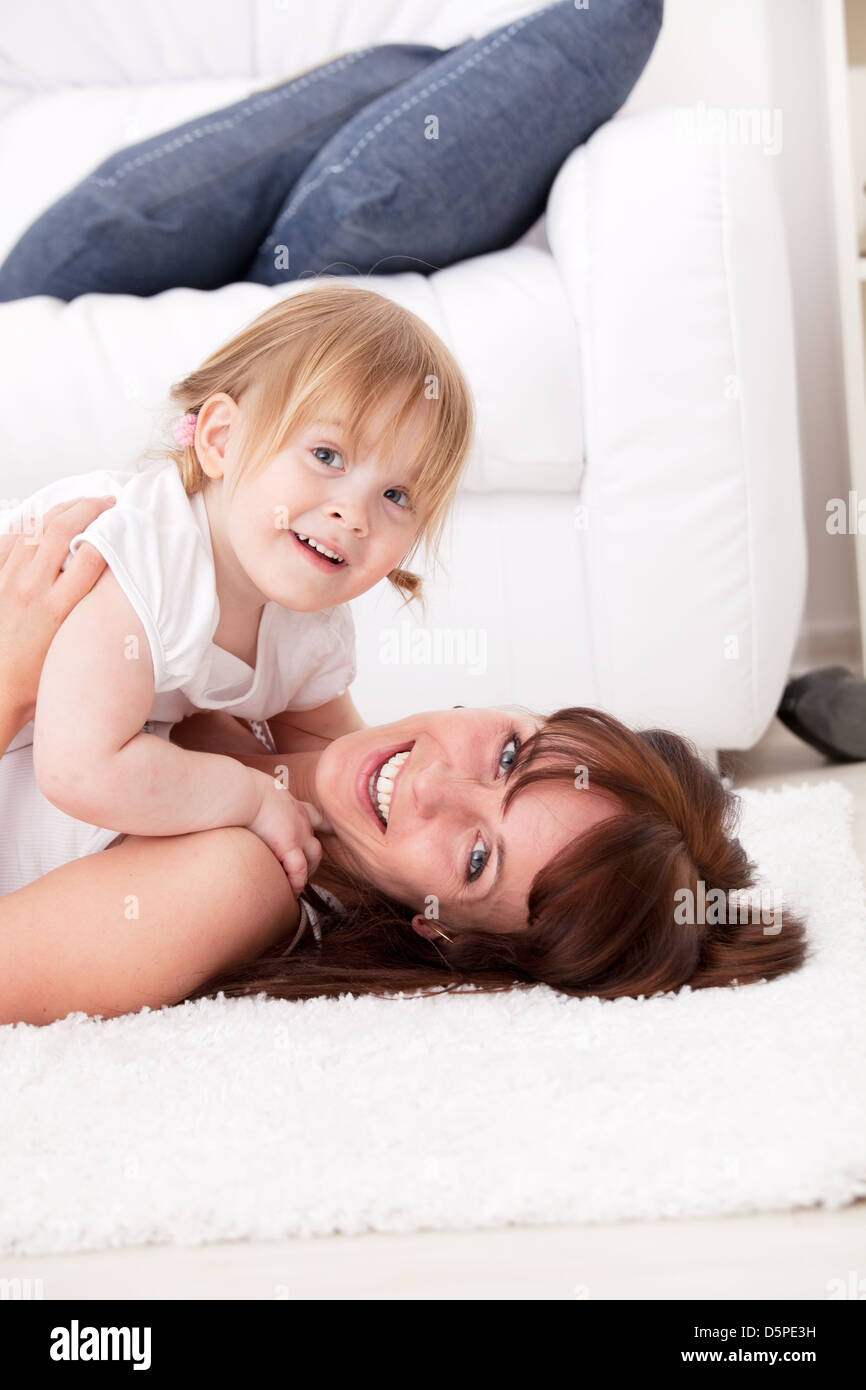 Mother and daughter at home Stock Photo - Alamy