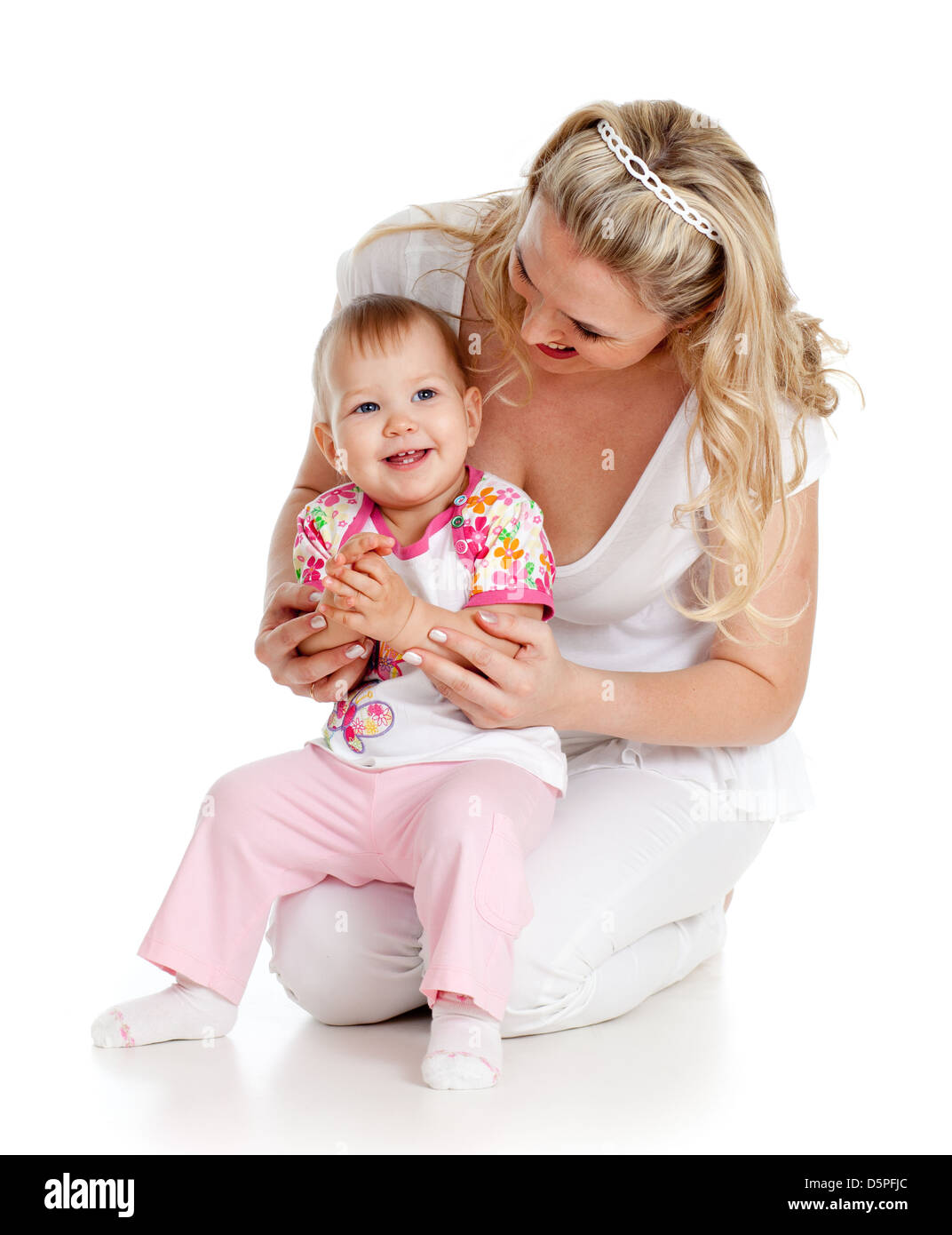 Child on loving mother's knees clapping his hands Stock Photo - Alamy