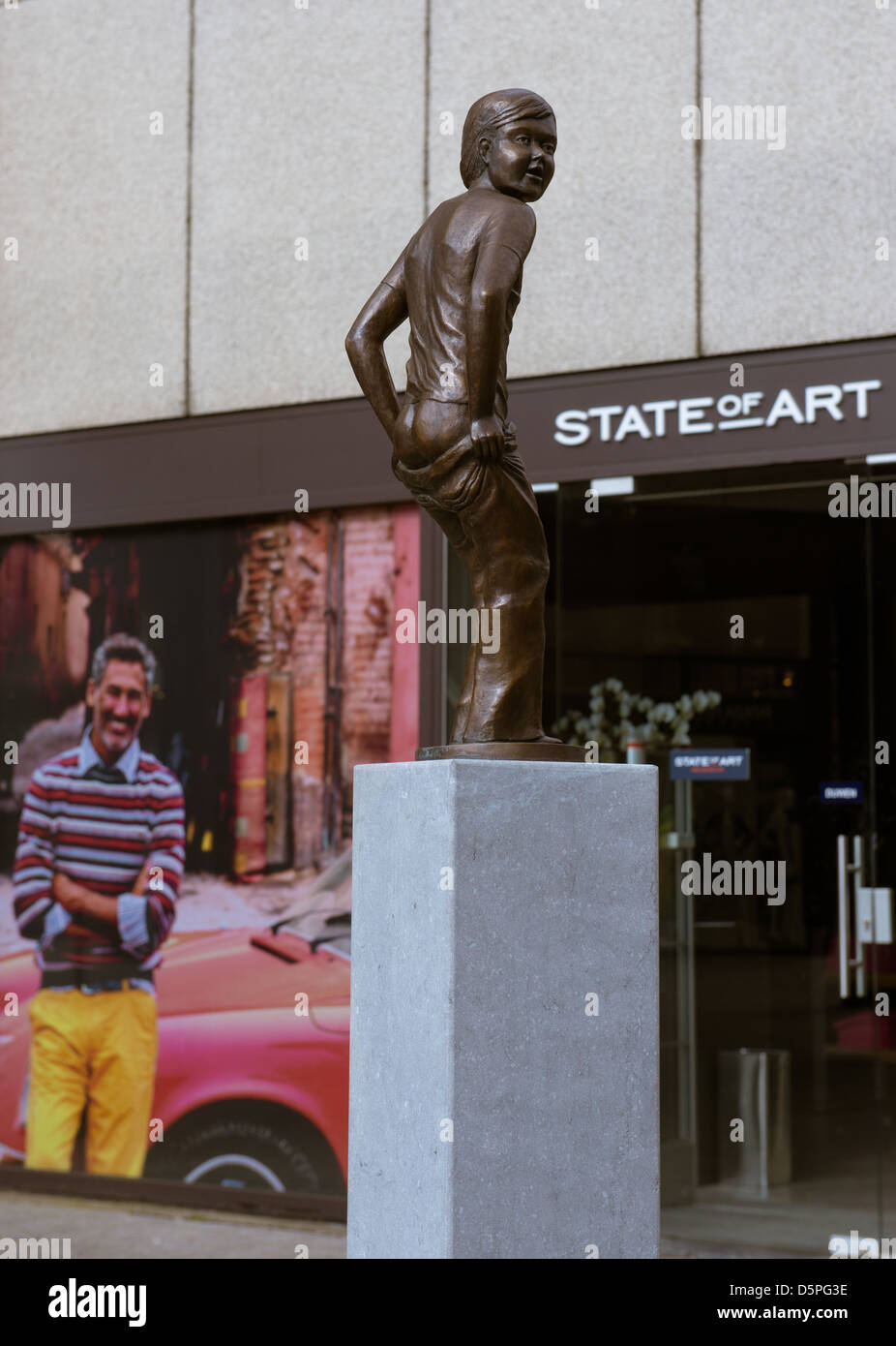 Statue of person lowering trousers mooning in Antwerp Stock Photo - Alamy