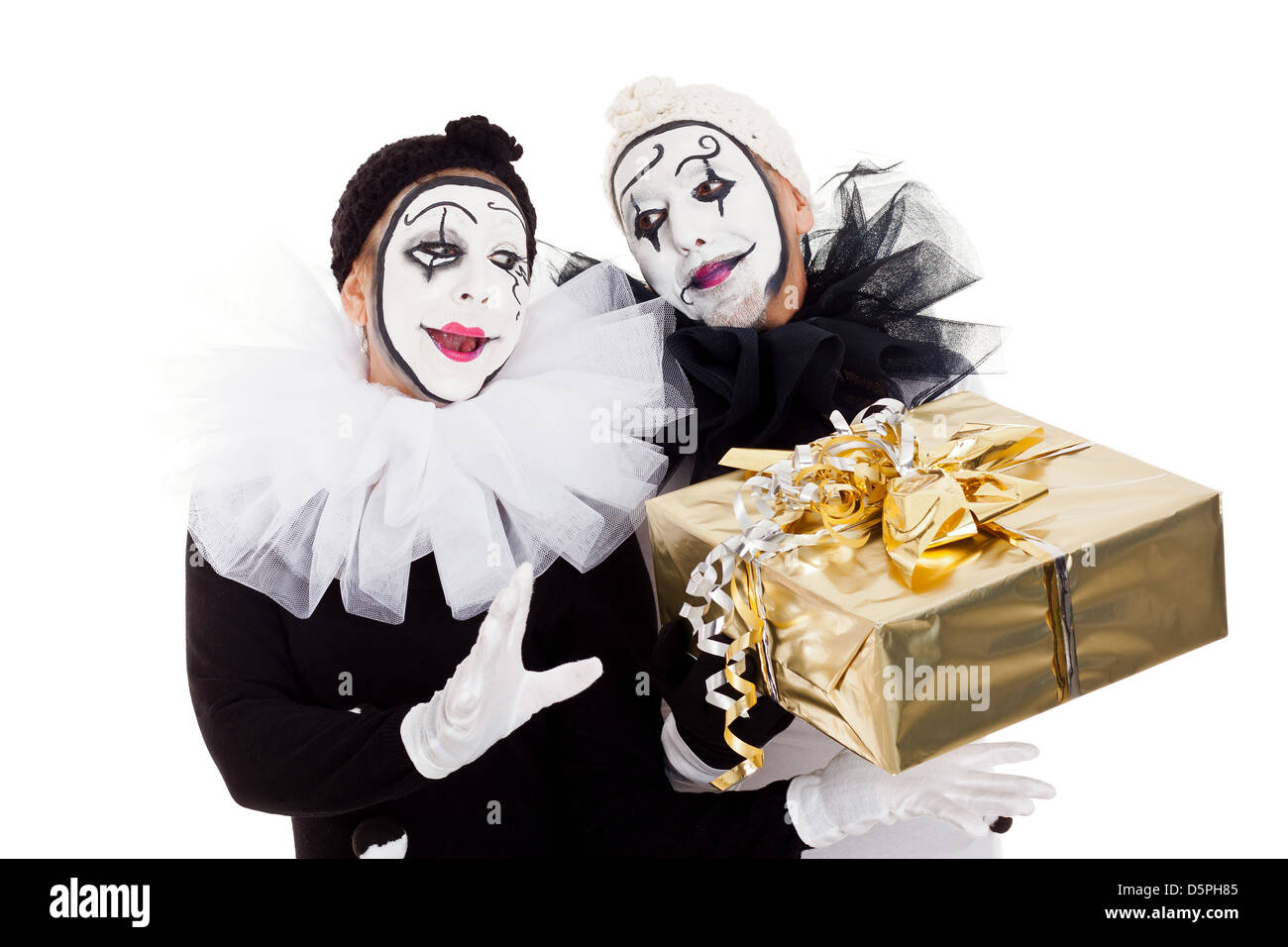 two clowns with a golden present Stock Photo - Alamy