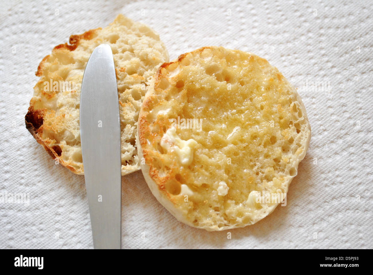 Buttering an English Muffin Stock Photo - Alamy