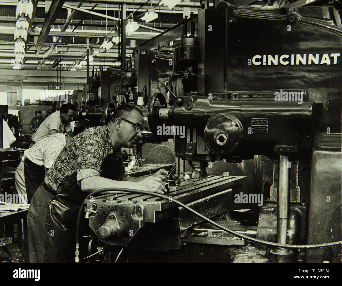 Workers and machines hi-res stock photography and images - Alamy