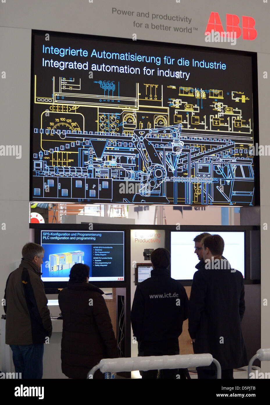 Visitors look at a control panel for the process automation at the ...