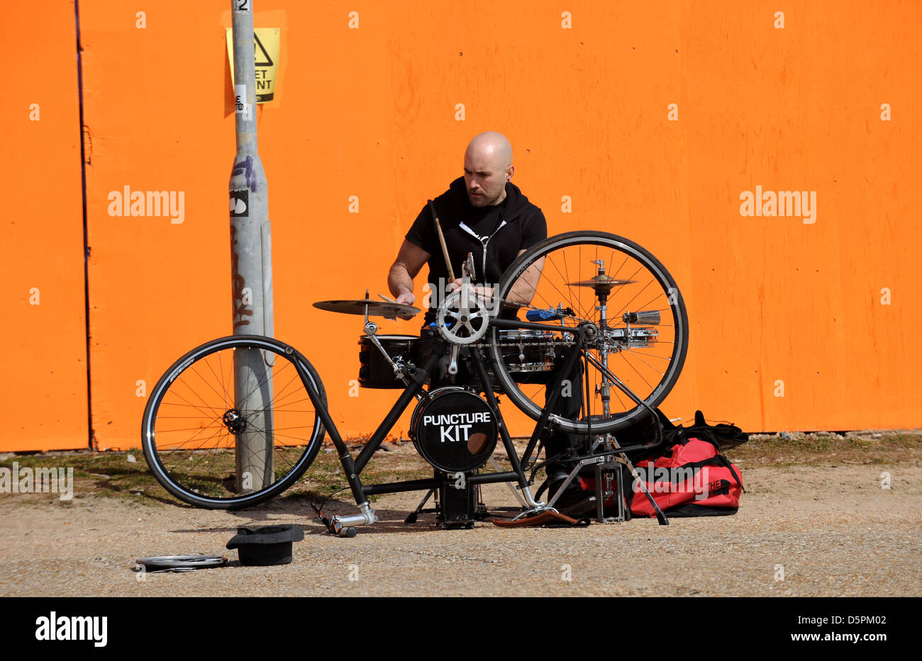 Busker David Osborne known as Puncture Kit as he plays a set of drums ...