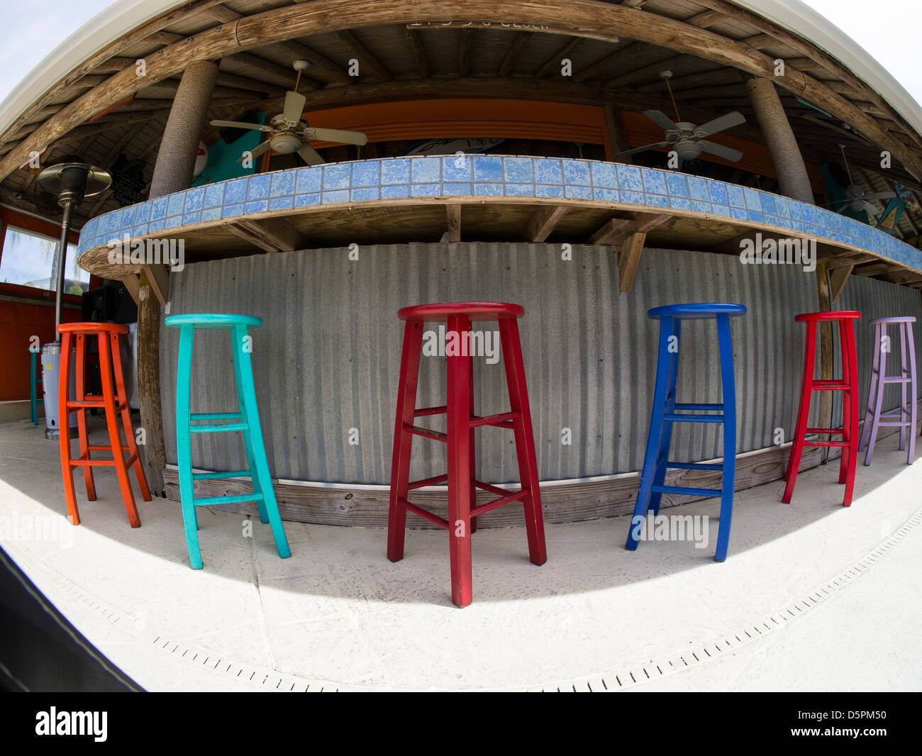 Fisheye view of Colorful empty barstools lined up at a bar Stock Photo ...