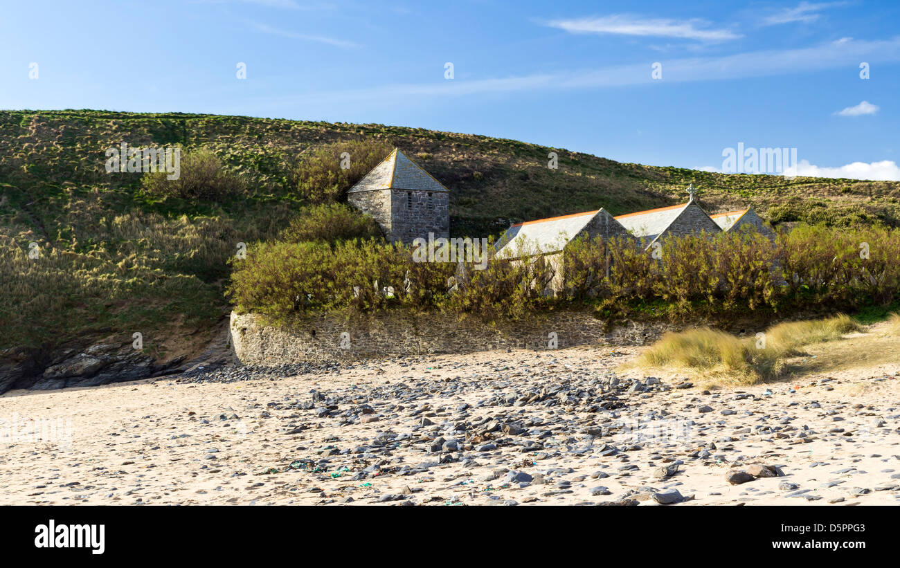 The beach and Church of St Winwaloe at Gunwalloe Church Cove Cornwall ...