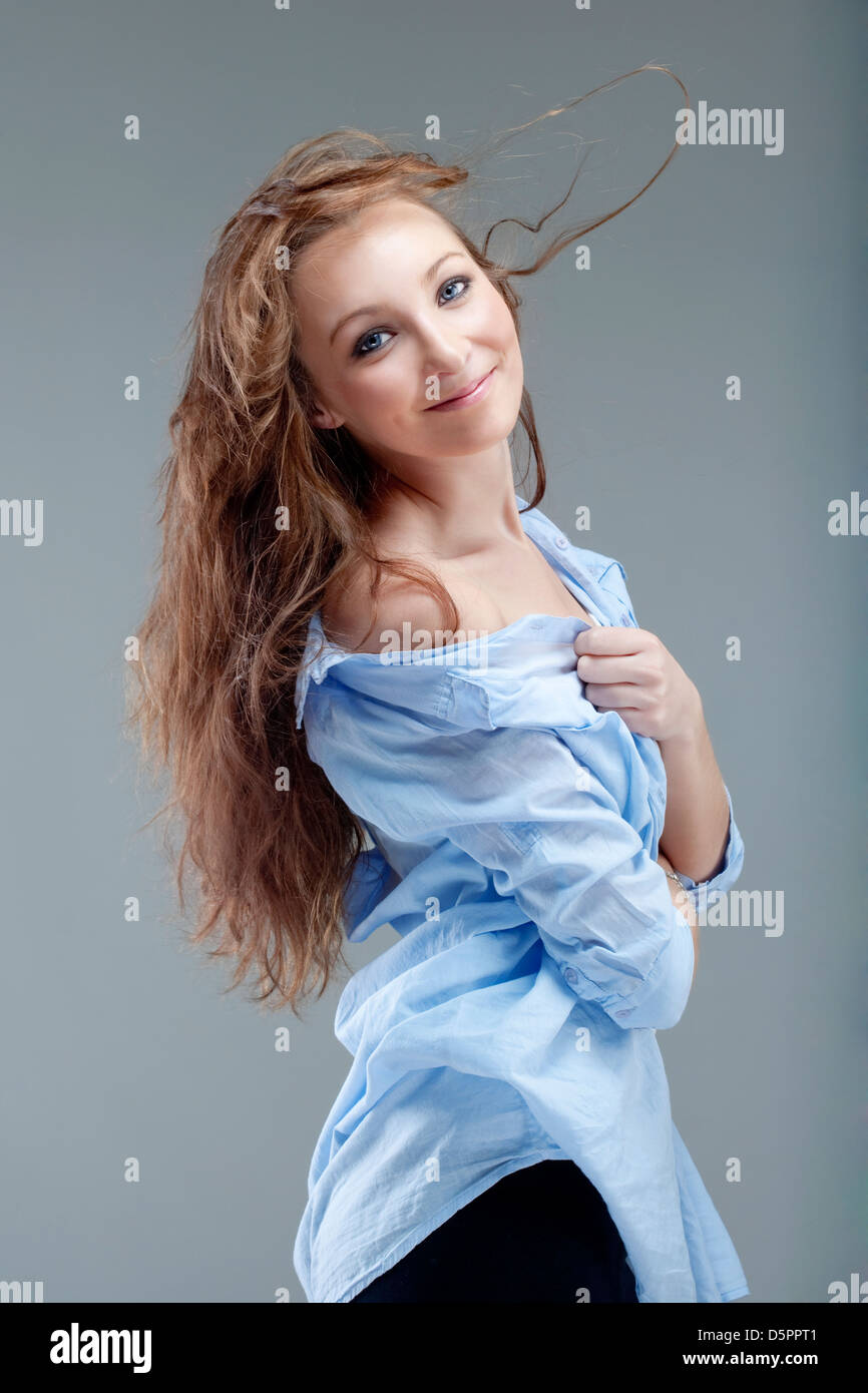 portrait of a young beautiful woman with brown hair smiling - isolated ...