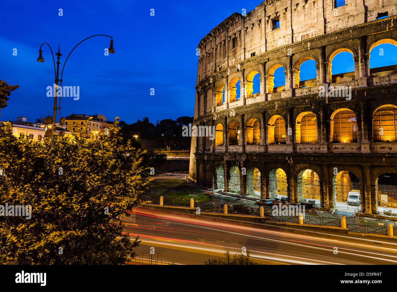 Colosseum in Rome, Italy at night with traffic light streaks Stock ...