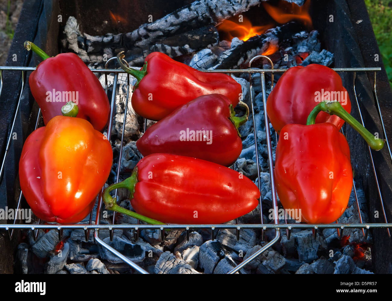 Ripe red paprika baked on grill Stock Photo - Alamy