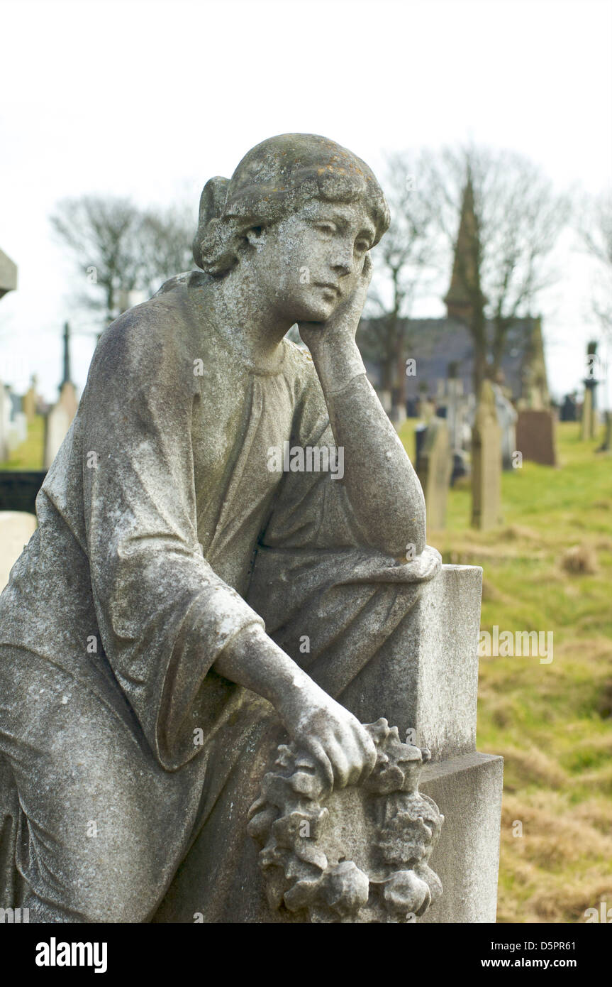 Statue of sad women on grave in cemetery Stock Photo - Alamy