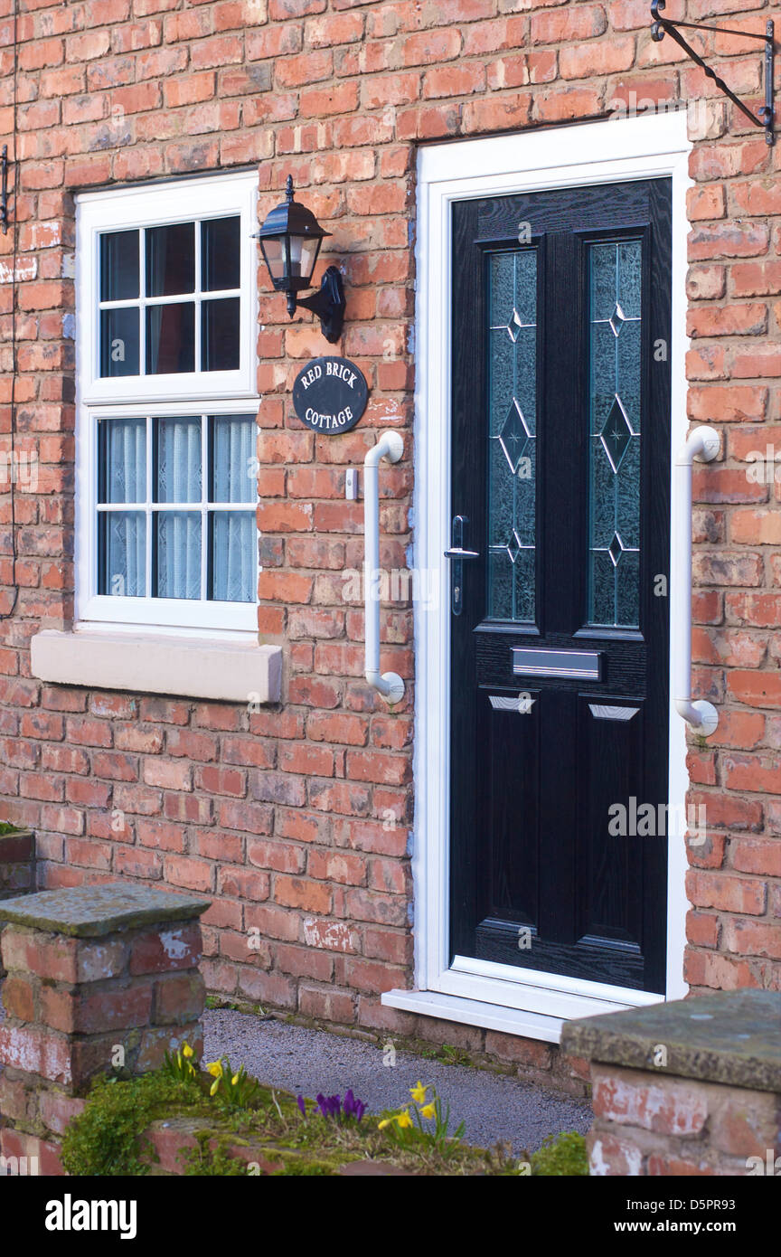 Front of small terraced cottage home Stock Photo - Alamy