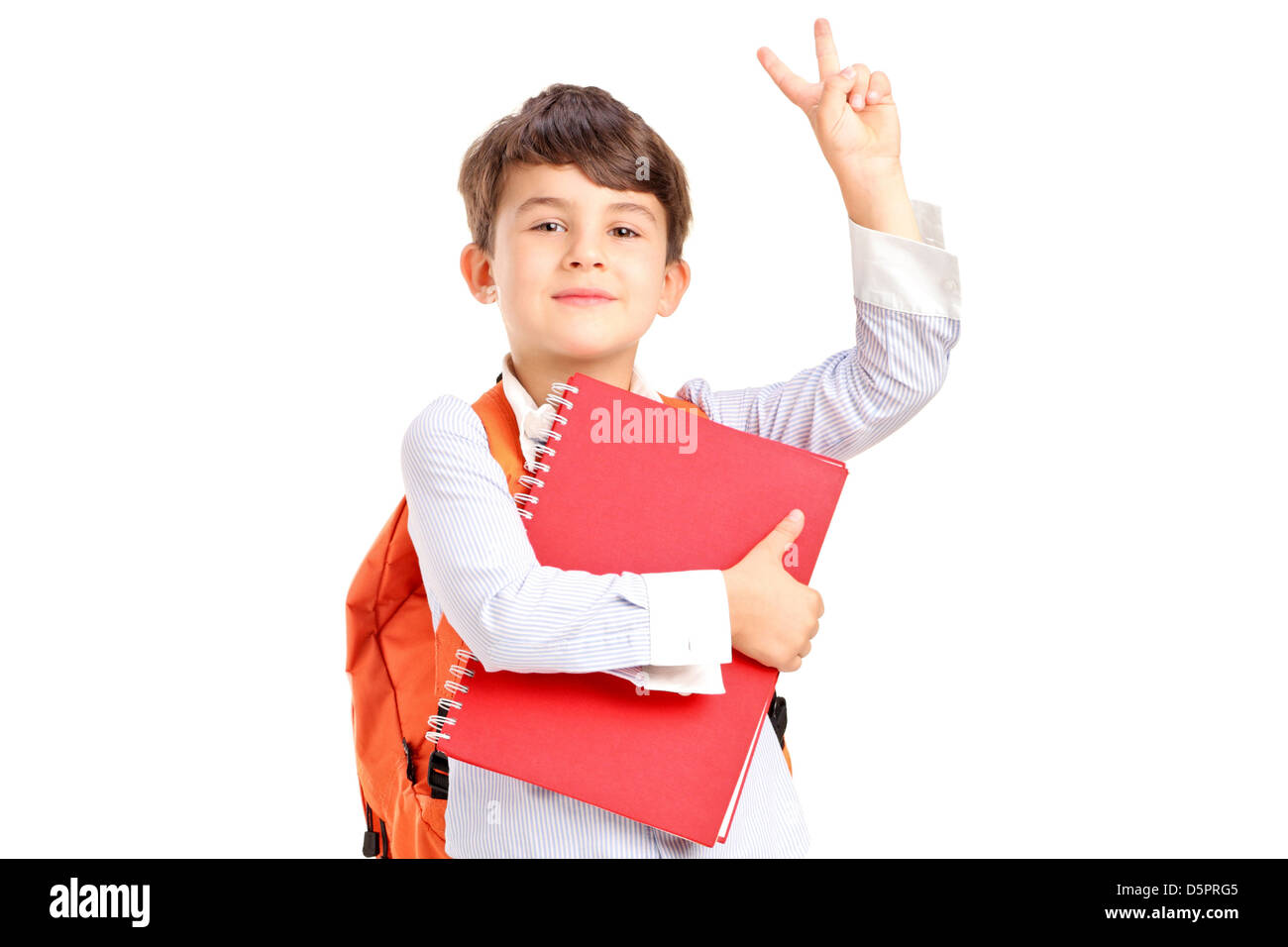A school boy holding a notebook and gesturing isolated on white ...
